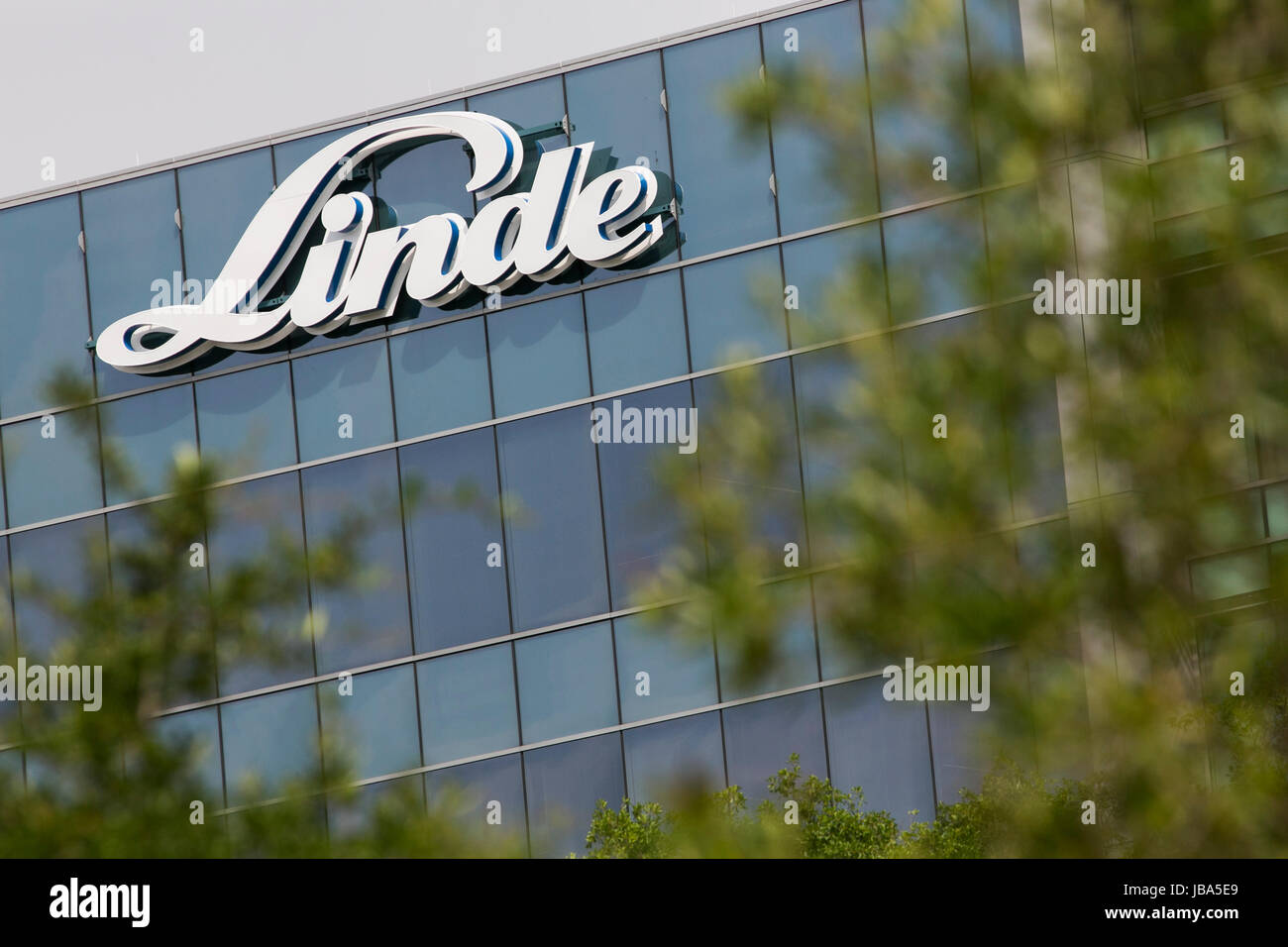 A logo sign outside of a facility occupied by The Linde Group in ...