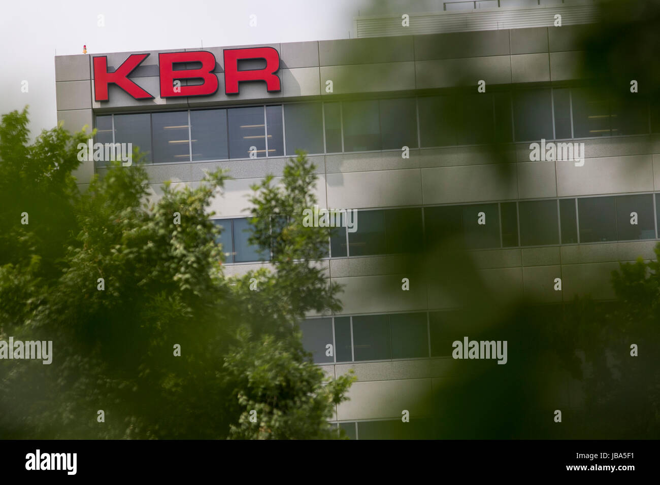 A logo sign outside of a facility occupied by KBR, Inc, in Houston ...