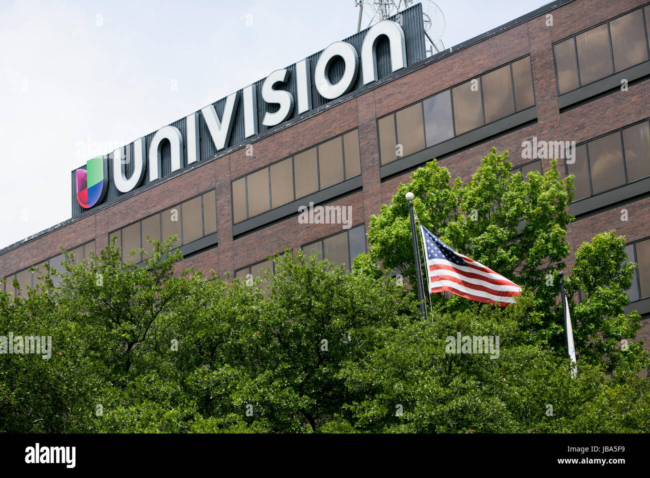 A logo sign outside of a facility occupied by Univision Communications ...