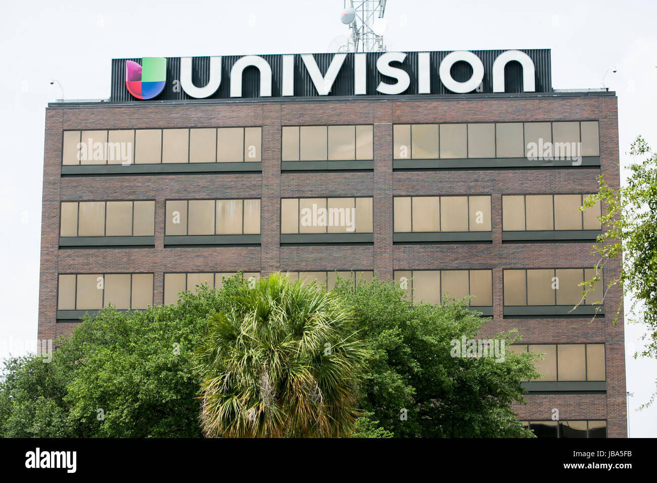 A logo sign outside of a facility occupied by Univision Communications ...