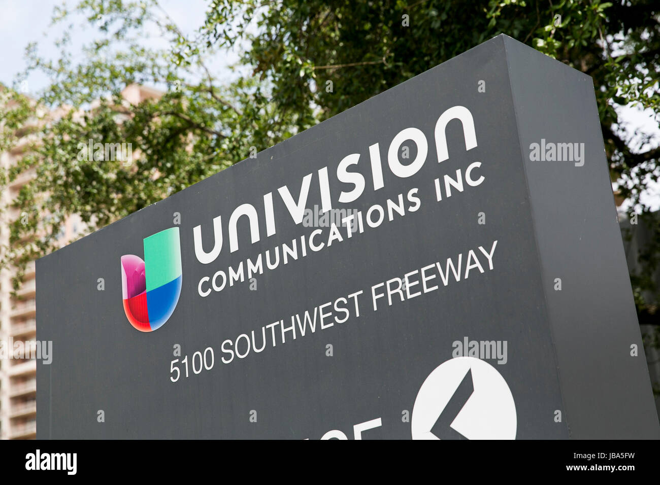 A logo sign outside of a facility occupied by Univision Communications ...