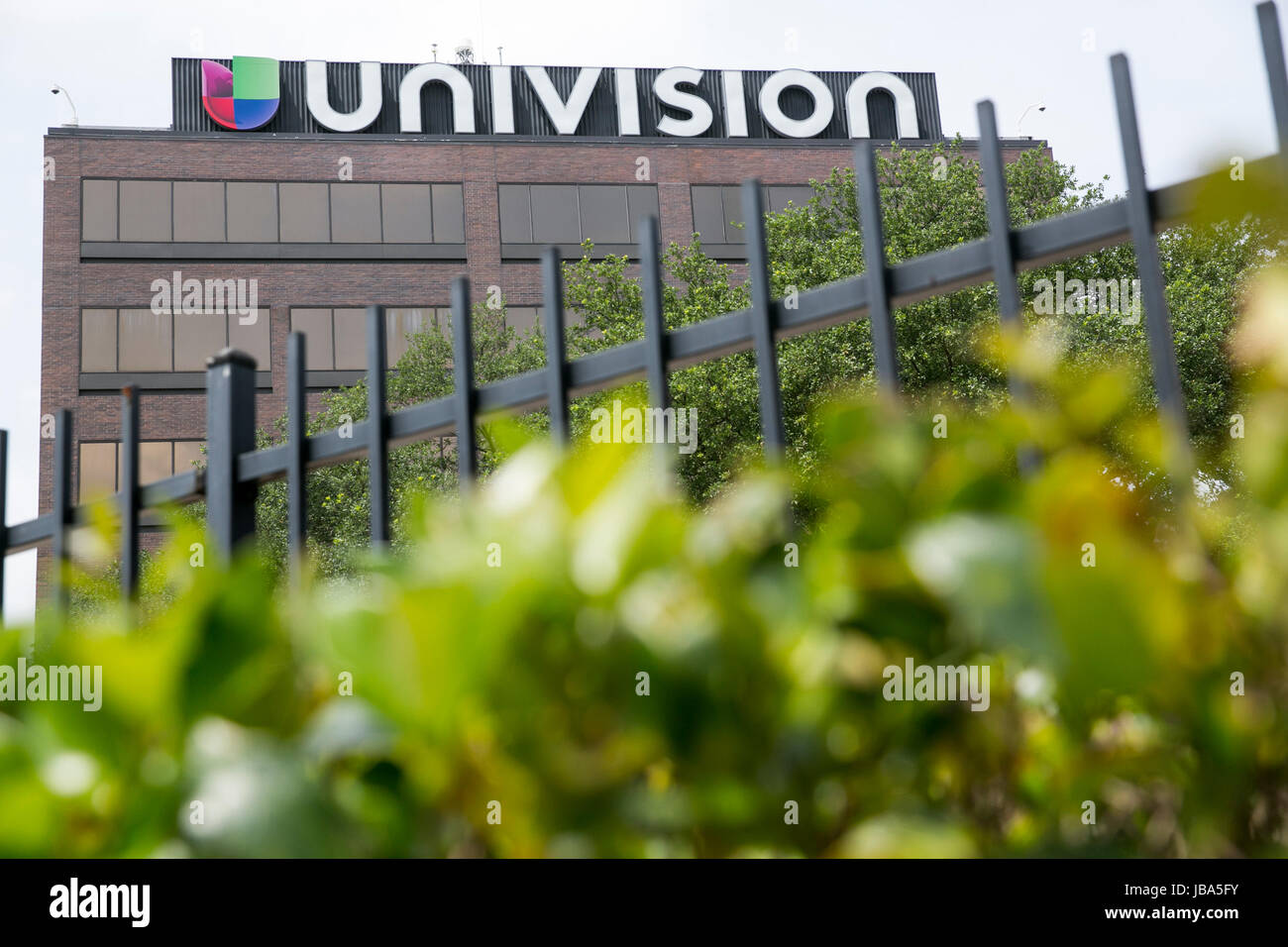 A logo sign outside of a facility occupied by Univision Communications ...