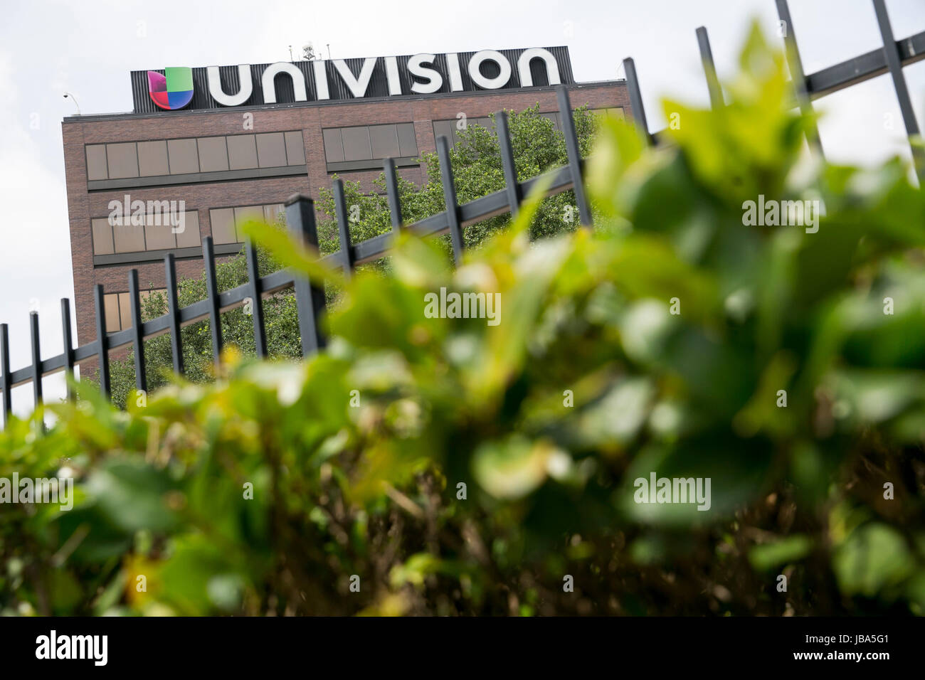A logo sign outside of a facility occupied by Univision Communications ...