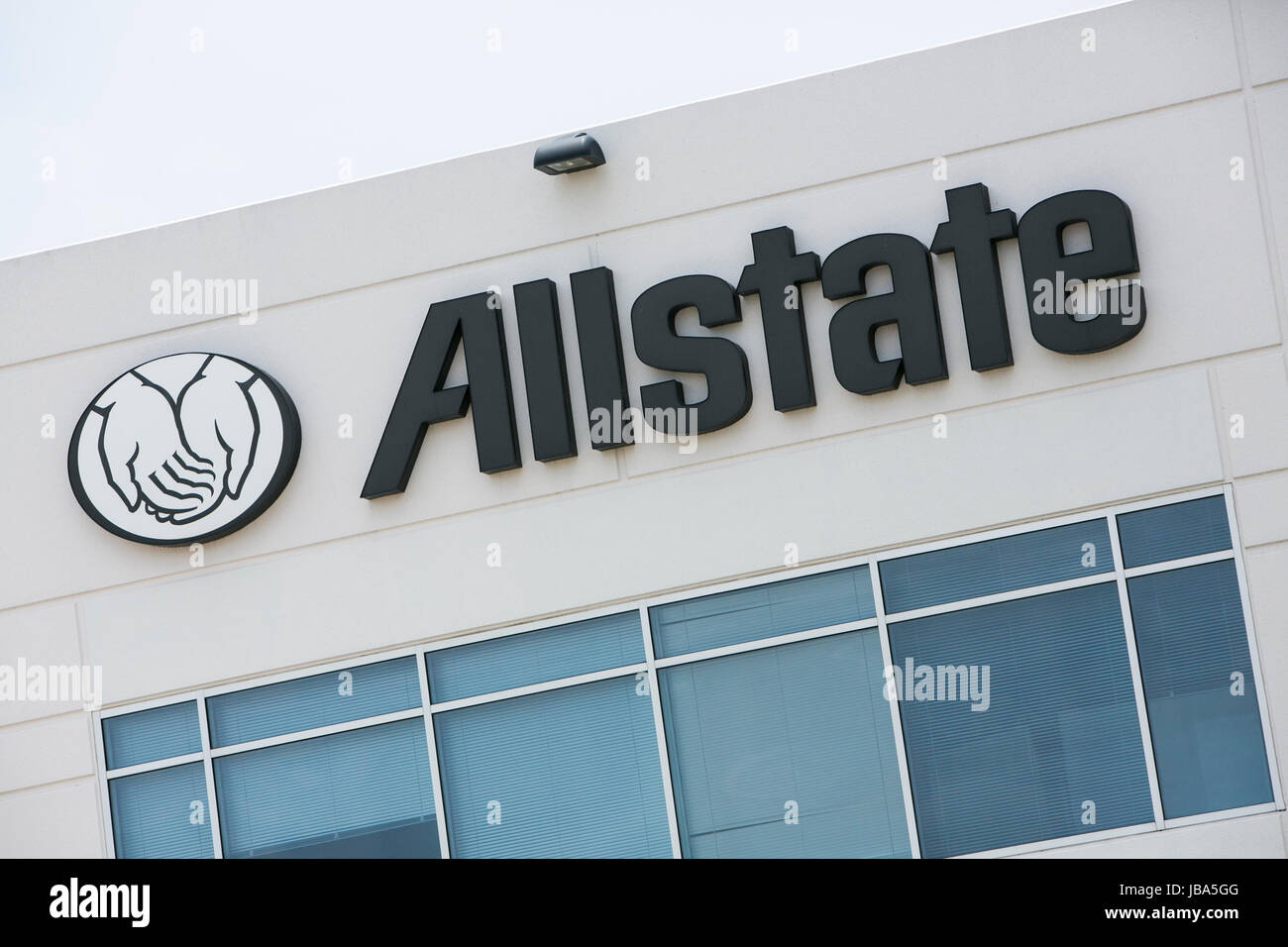 A logo sign outside of a facility occupied by The Allstate Corporation ...
