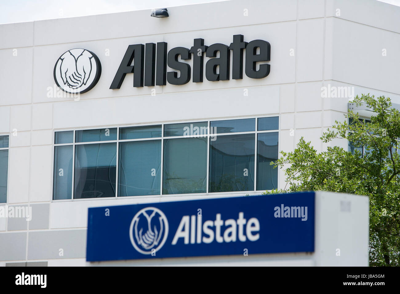 A logo sign outside of a facility occupied by The Allstate Corporation ...
