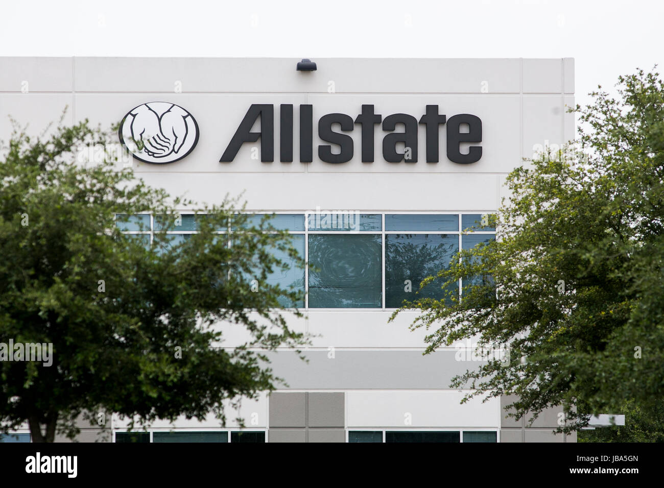 A logo sign outside of a facility occupied by The Allstate Corporation ...