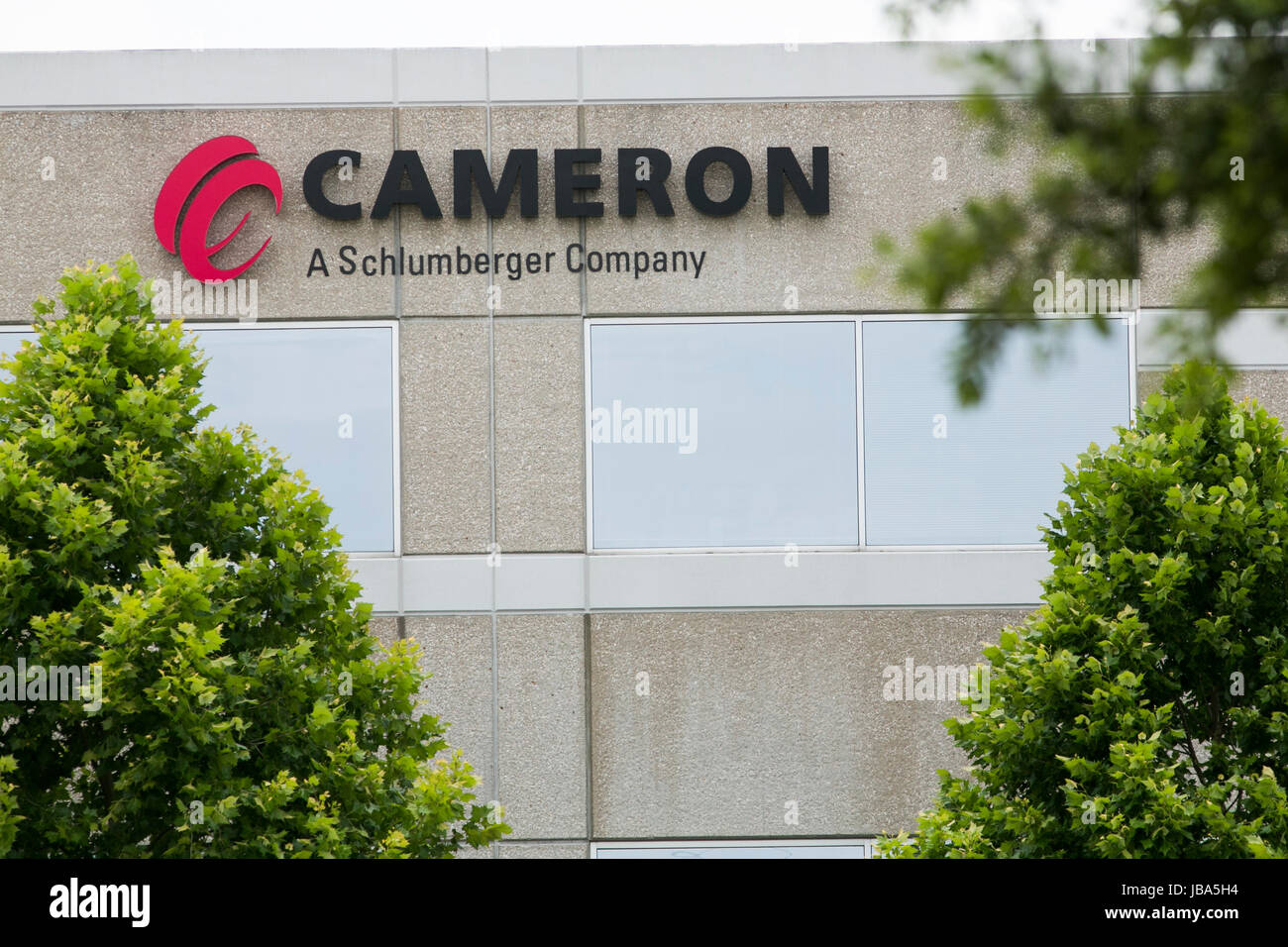 A logo sign outside of a facility occupied by the Cameron International ...