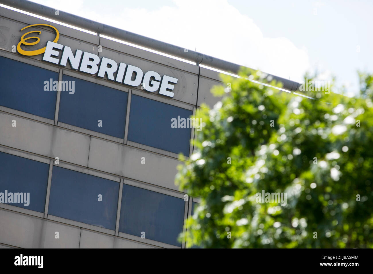 A logo sign outside of a facility occupied by Enbridge, Inc., in ...