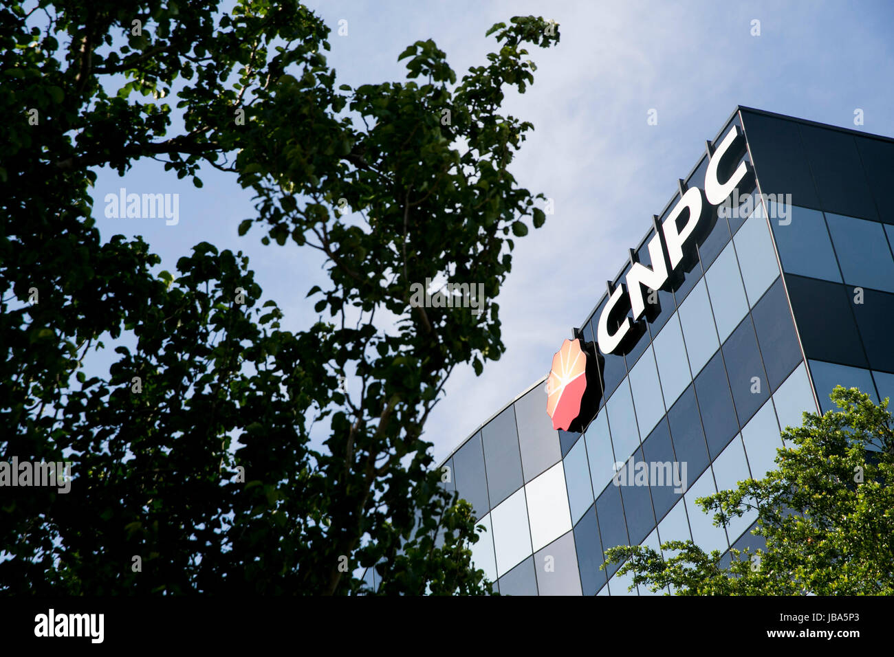 A logo sign outside of a facility occupied by the China National ...