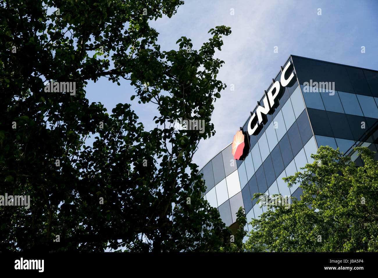 A logo sign outside of a facility occupied by the China National ...