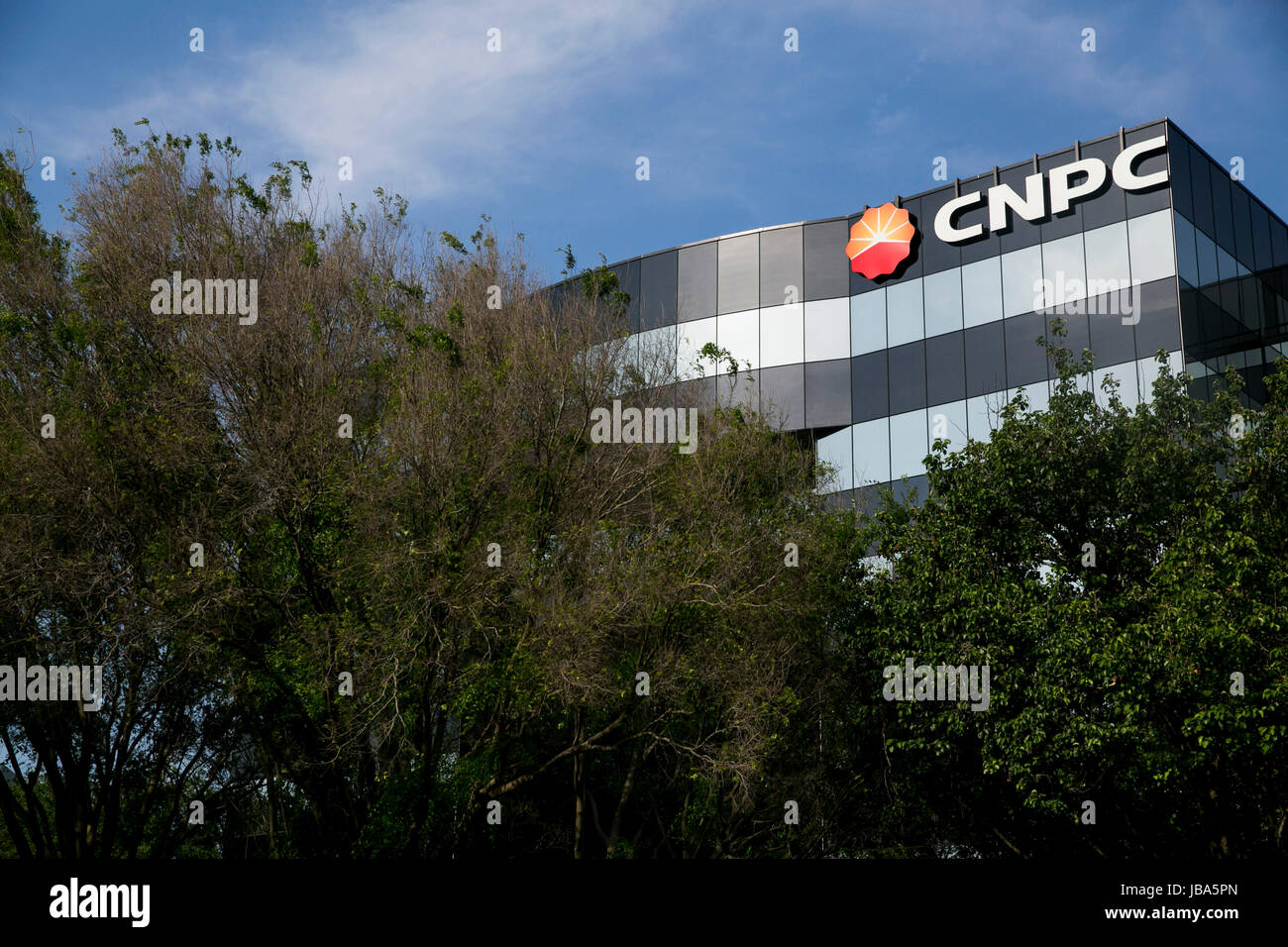 A logo sign outside of a facility occupied by the China National ...