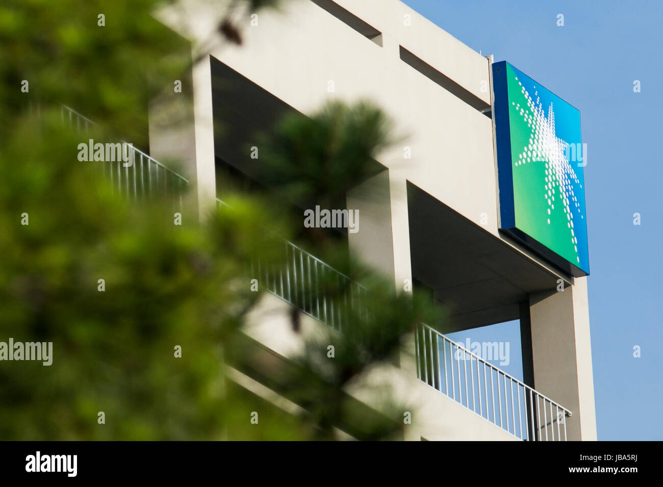 A logo sign outside of a facility occupied by Saudi Aramco in Houston ...