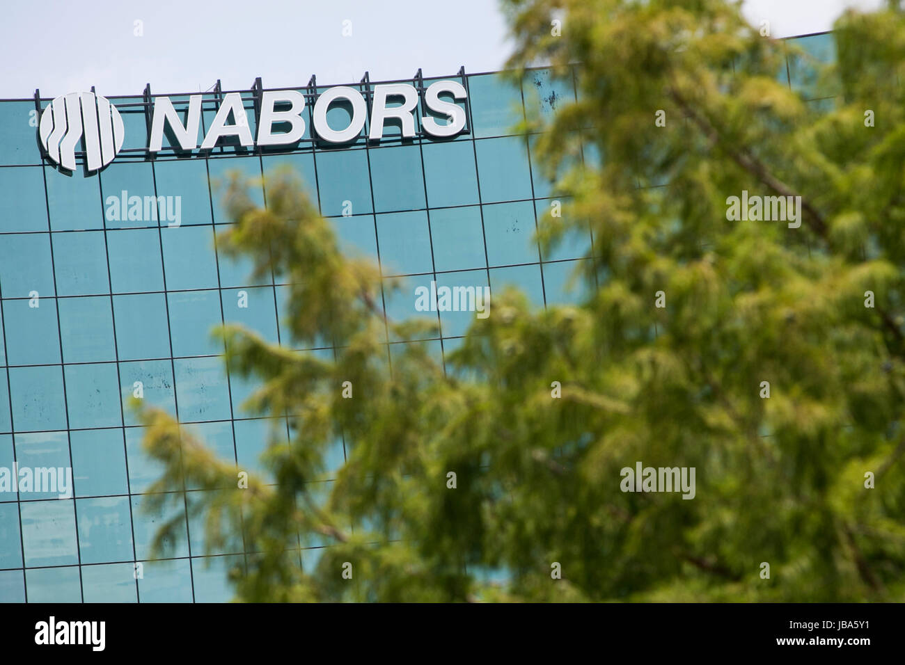 A logo sign outside of a facility occupied by Nabors Industries Ltd, in ...