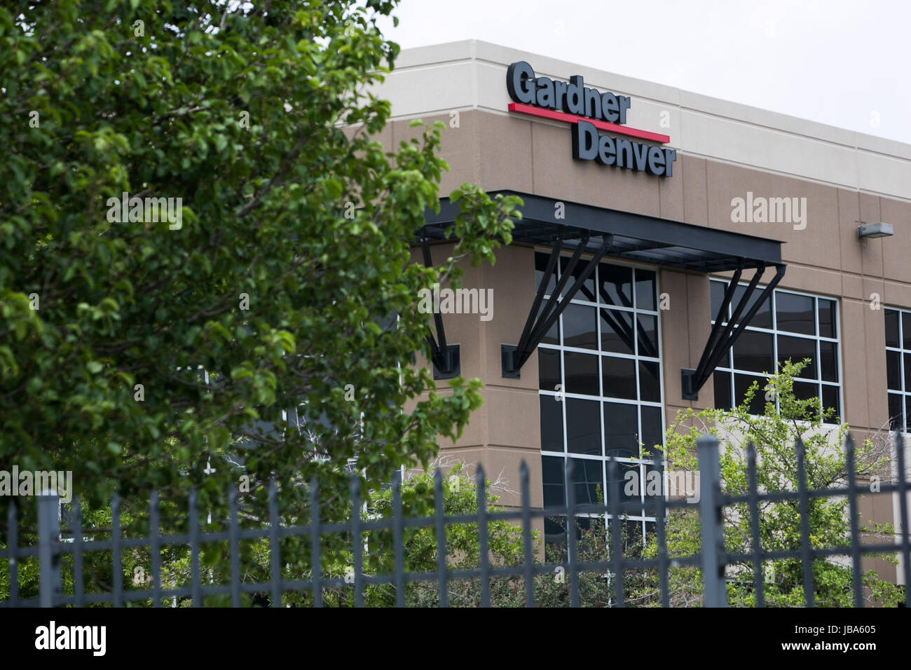 A logo sign outside of a facility occupied by Gardner Denver in Houston ...