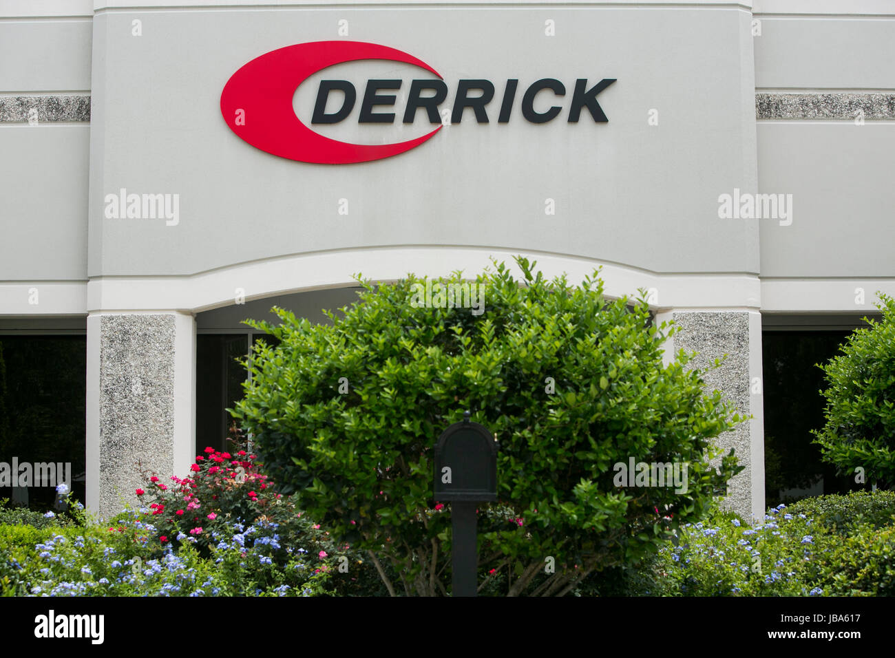 A logo sign outside of a facility occupied by the Derrick Equipment ...