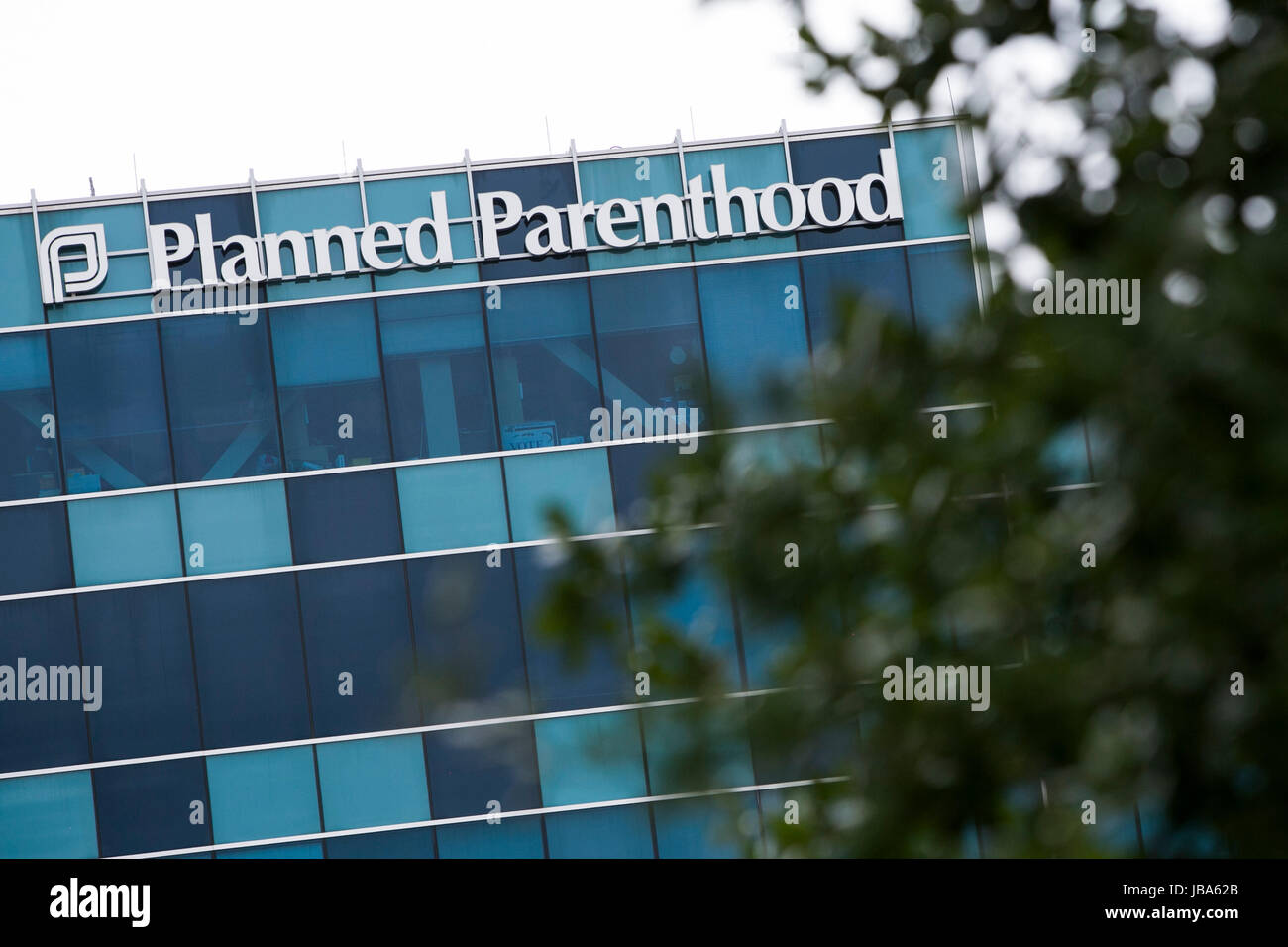 A logo sign outside of a facility occupied by Planned Parenthood in ...