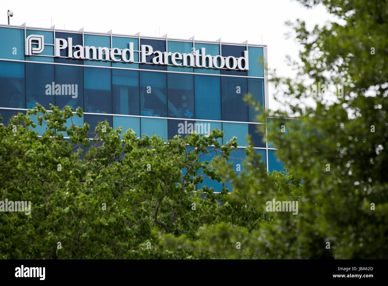 A logo sign outside of a facility occupied by Planned Parenthood in ...