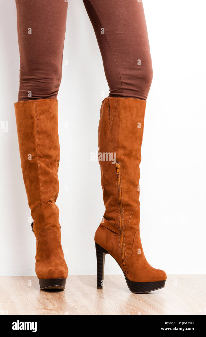 detail of standing woman wearing brown boots Stock Photo - Alamy