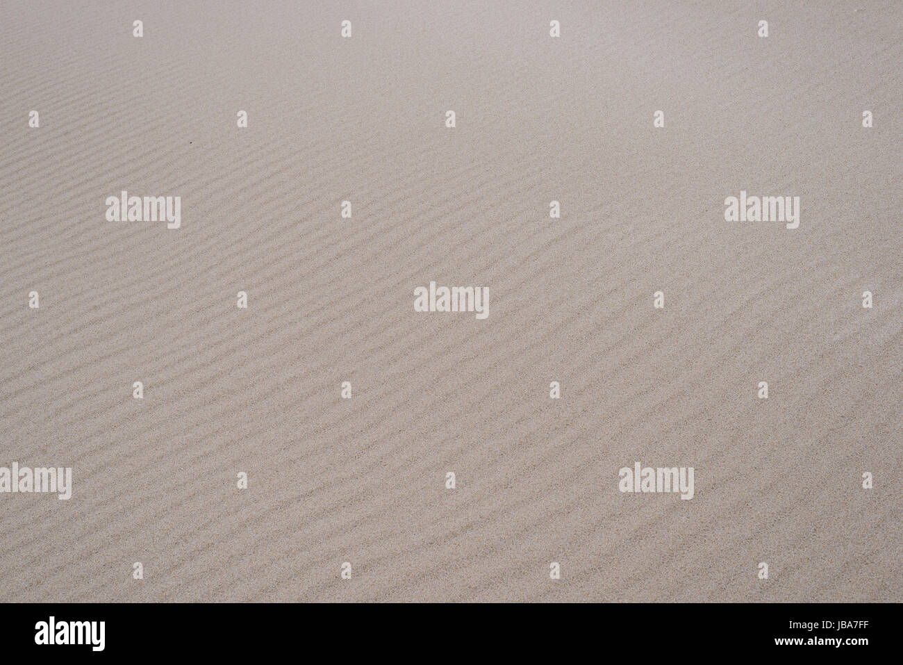 Sand texture with wind formed ripple pattern Stock Photo - Alamy