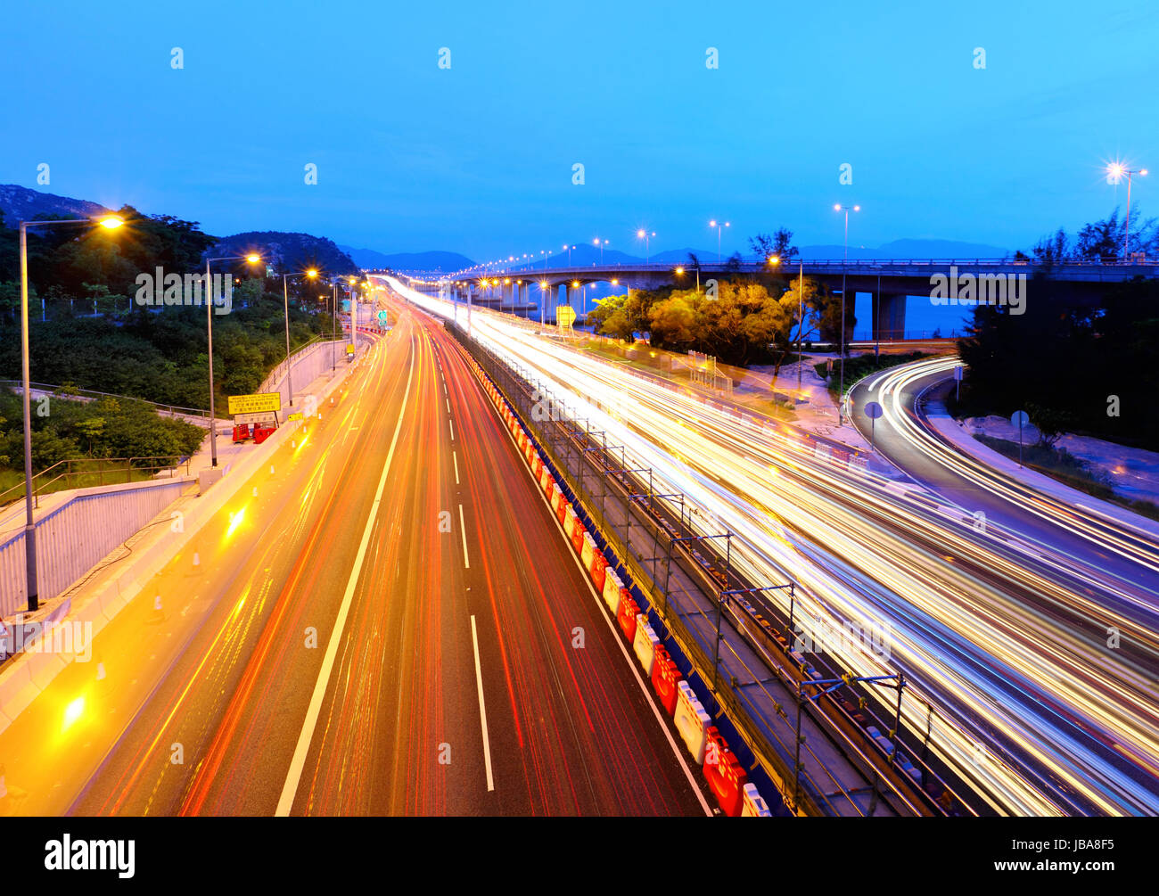 Highway at evening Stock Photo - Alamy