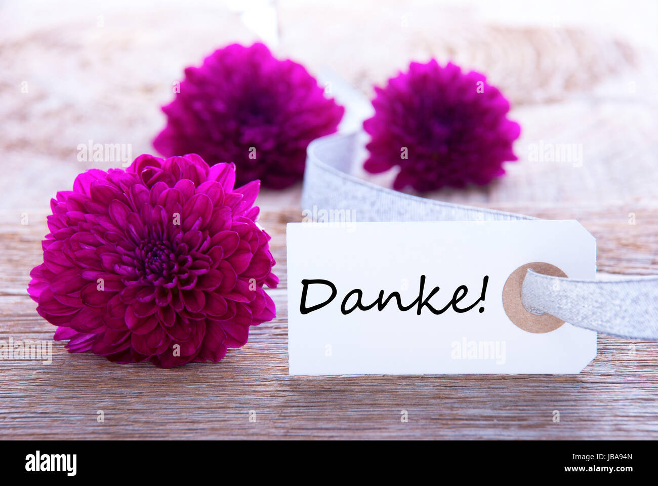 Label with the german word Danke which means Thanks and Purple Flowers ...