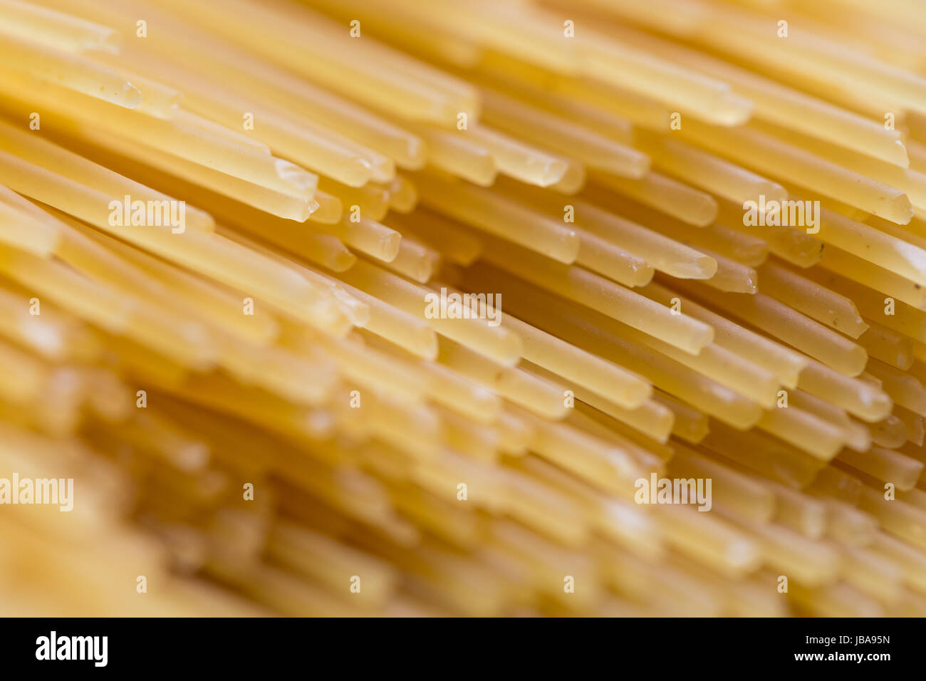 ribbed dry yellow macaroni with seriated line Stock Photo - Alamy