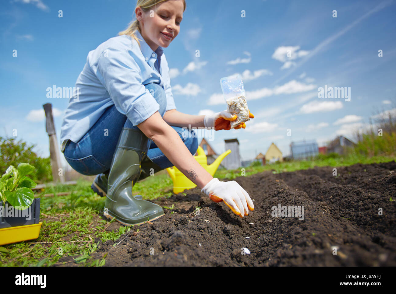 Image female farmer sowing seed hi-res stock photography and images - Alamy