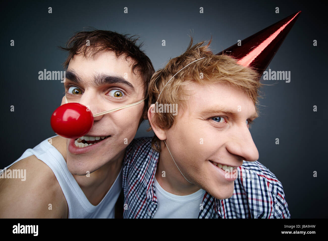 Two funny guys making faces at camera celebrating fool’s day Stock ...