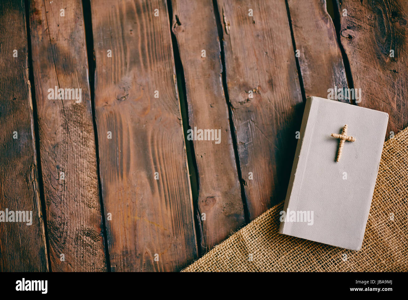 Image of Christian book with cross on its cover on wooden background ...