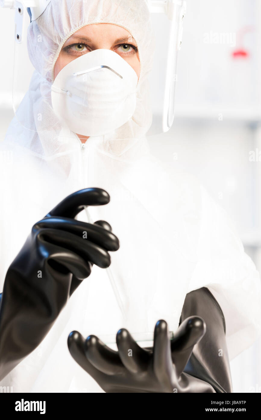young woman wearing protective clothes in laboratory Stock Photo - Alamy