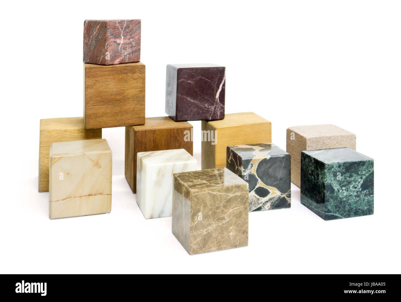 lots of various cubes made of different materials in white back Stock ...