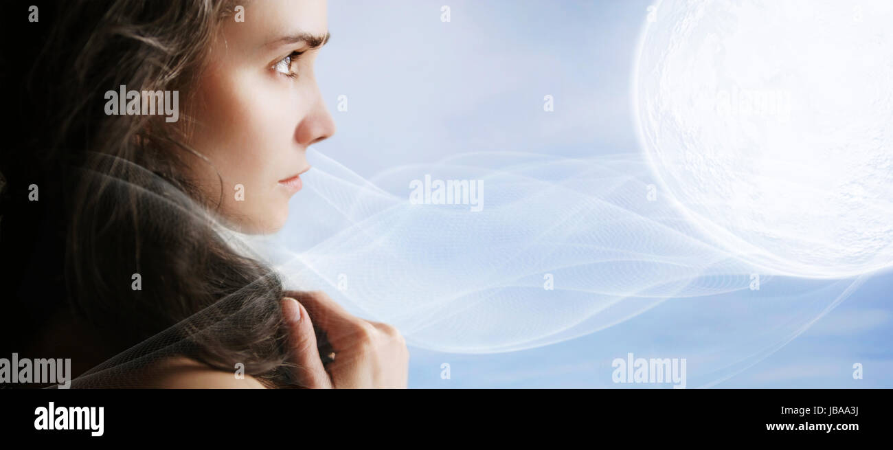 Beautiful young woman and moon on a blue sky background Stock Photo - Alamy