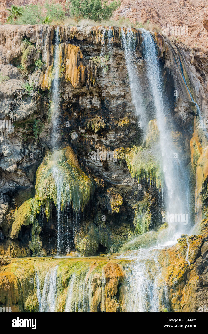 one woman bathing at ma'in hot springs waterfall in jordan middle east ...