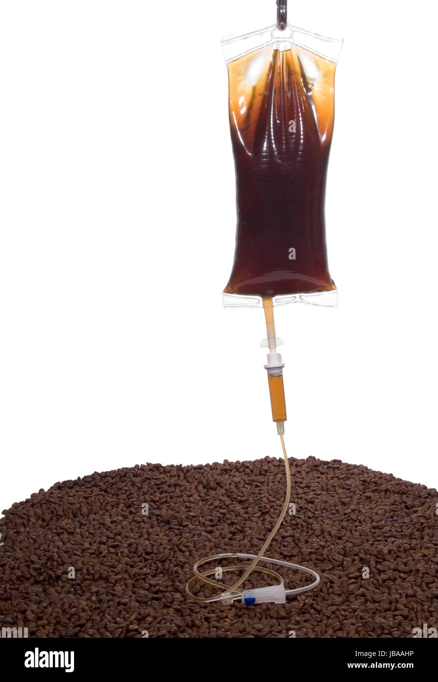 An IV bag of coffee hanging over coffee beans Stock Photo - Alamy