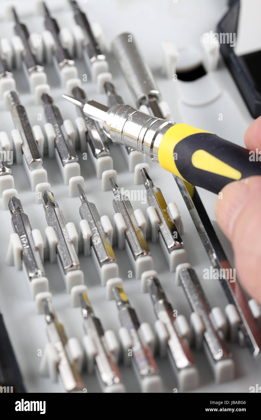 Man picking tool Stock Photo - Alamy