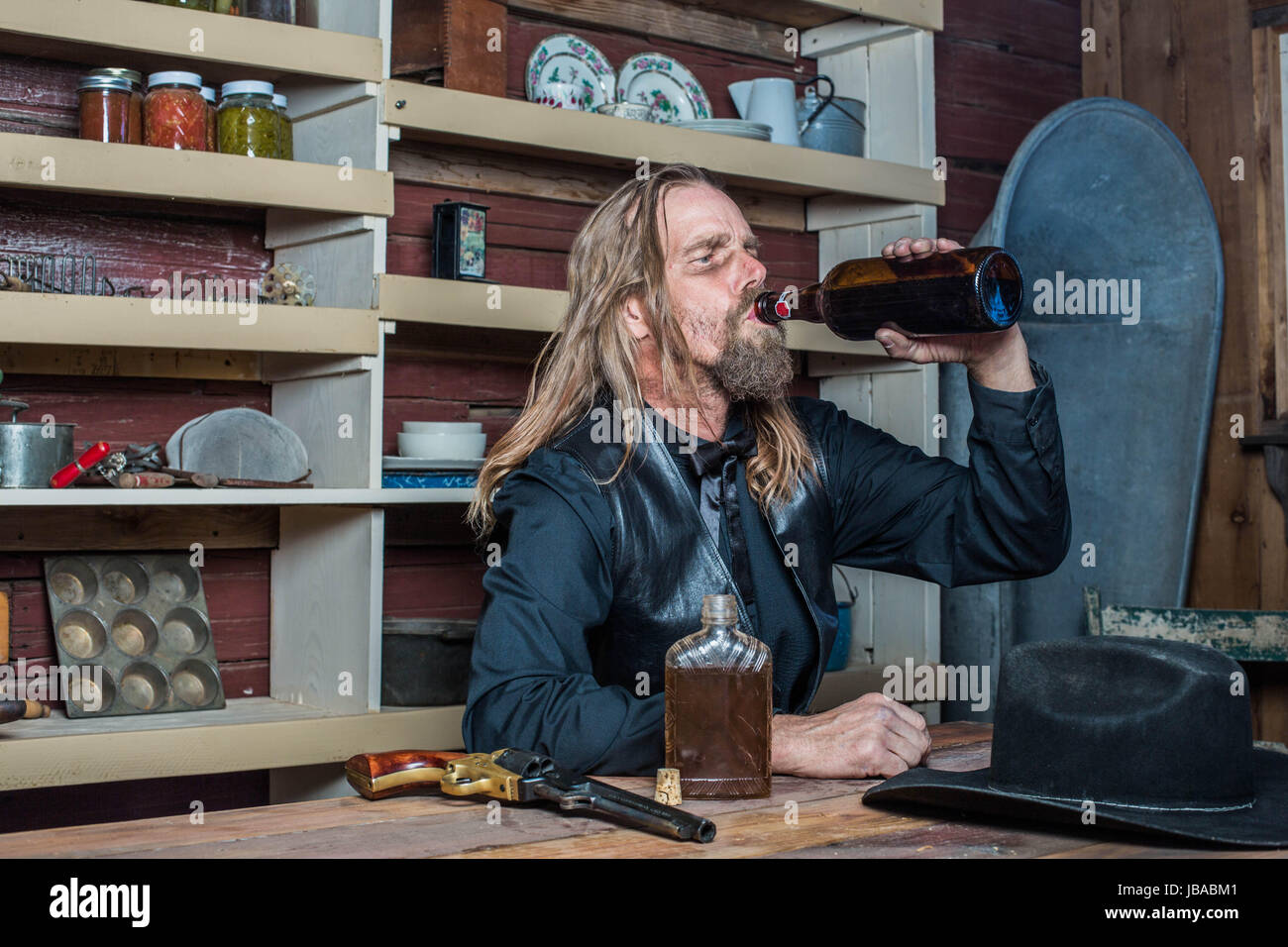 Cowboy drinking whiskey hi-res stock photography and images - Alamy