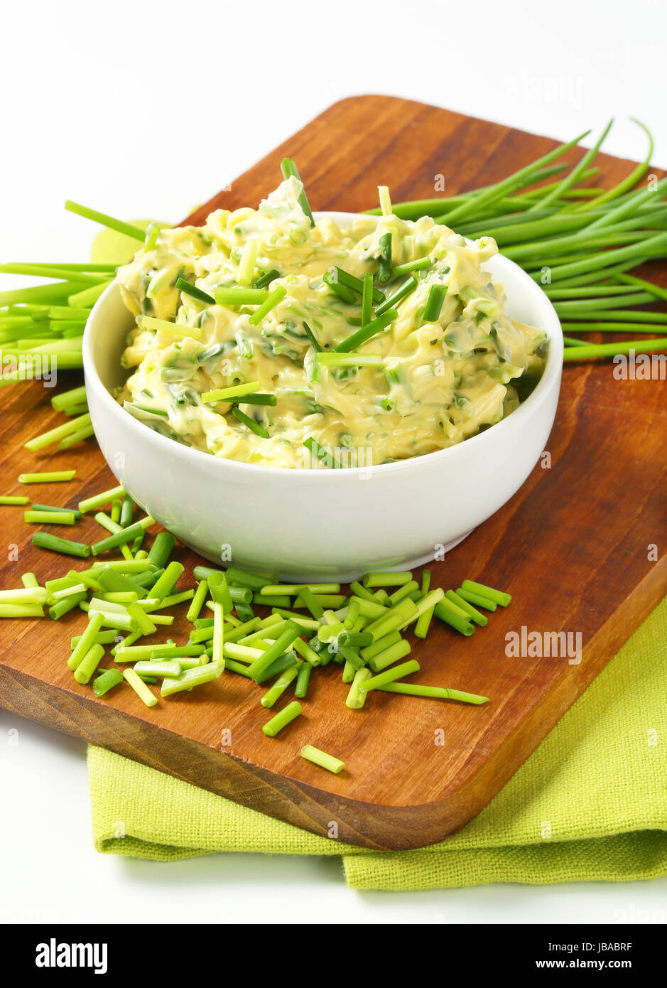 Bowl of homemade chive butter Stock Photo - Alamy
