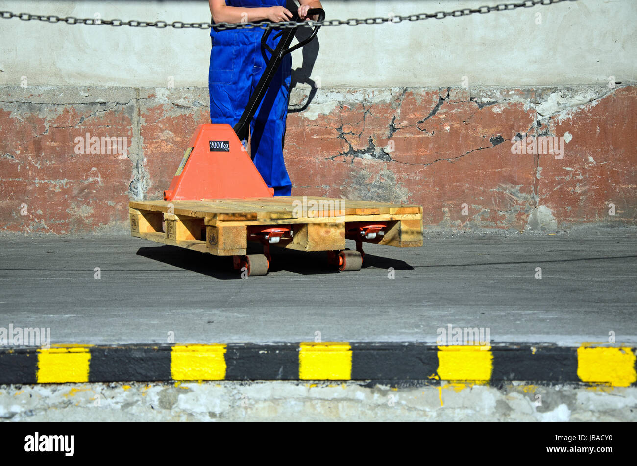 image of a working woman at the loading trolley Stock Photo - Alamy