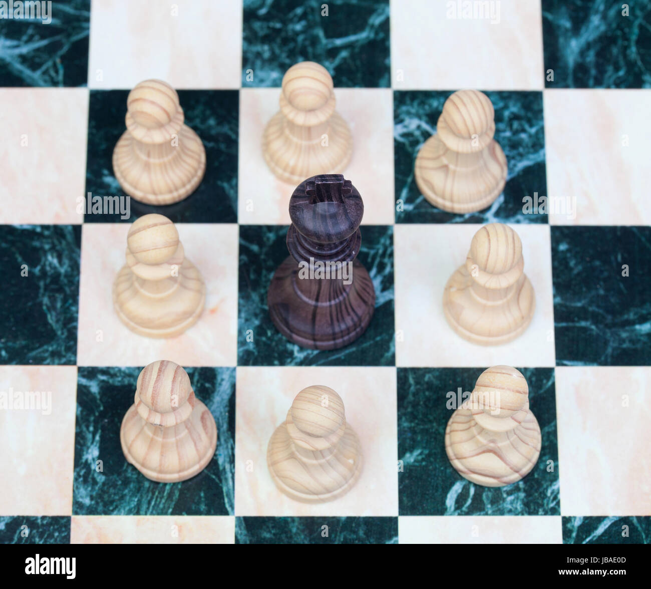 The black king surrounded by white pawns. Chess pieces on the ...