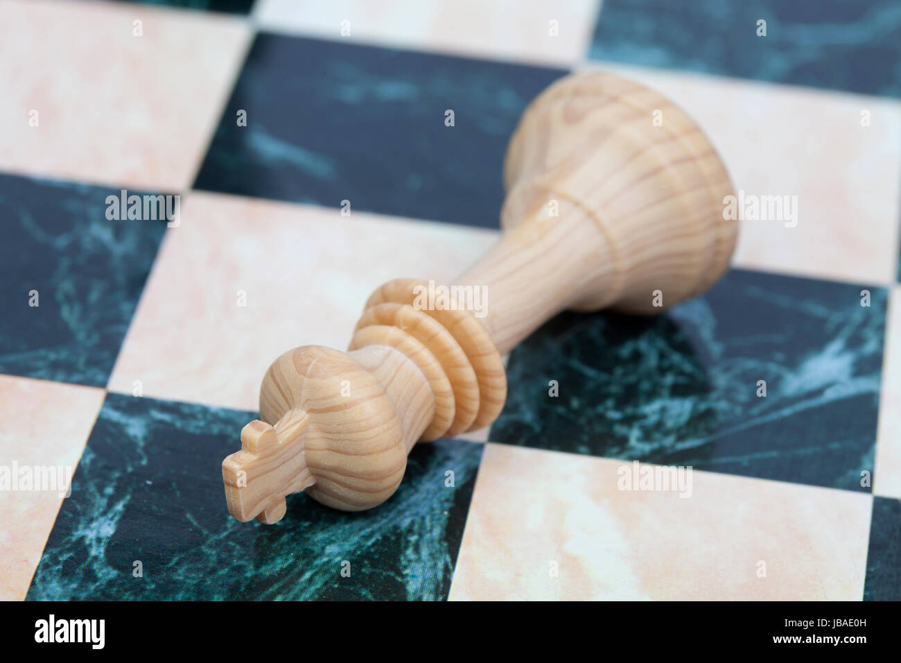 Checkmate. Wooden chess piece on chessboard Stock Photo - Alamy