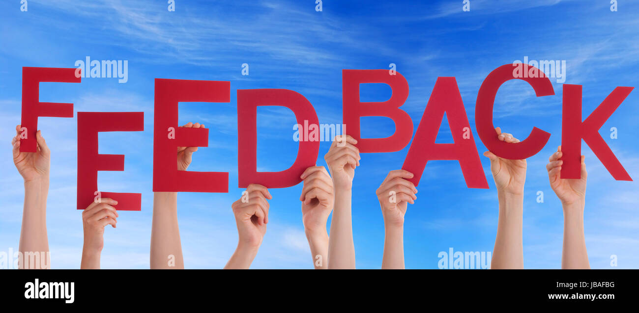 Hands Holding the Word Feedback in front of the Sky Stock Photo - Alamy