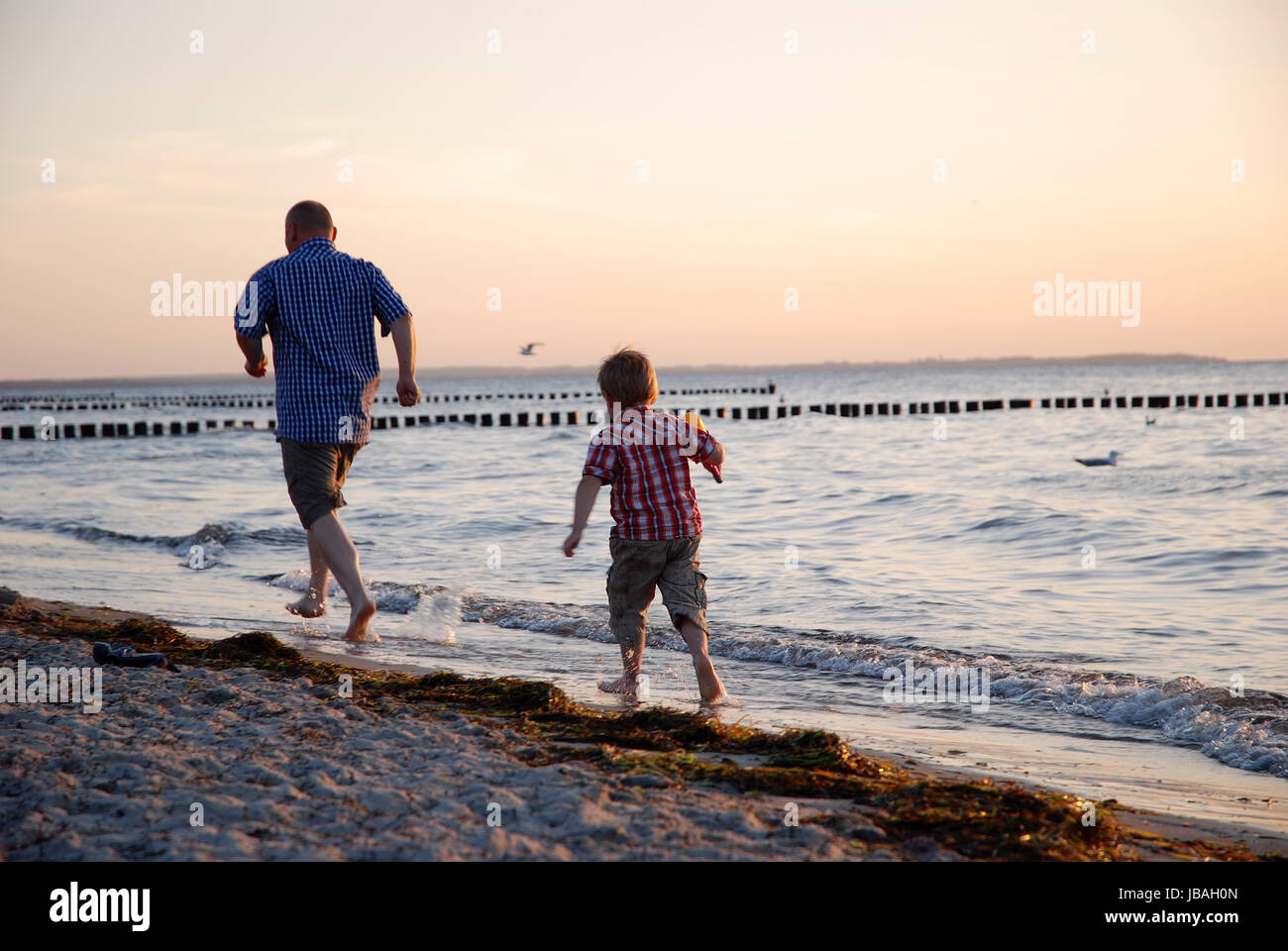 father and son on the beach Stock Photo - Alamy