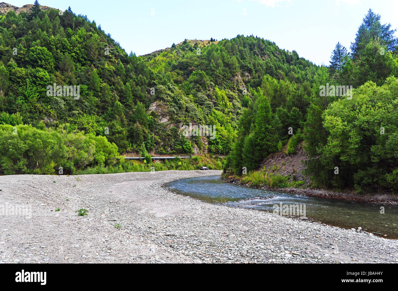 Granite stone at river with green tree Stock Photo - Alamy