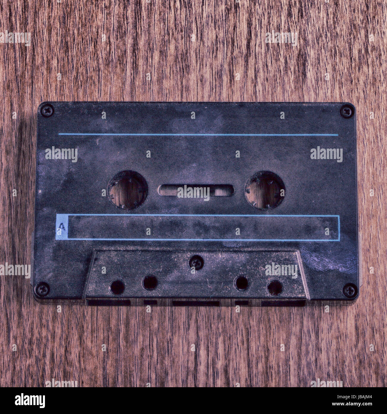 Old and dusty tape over wooden background Stock Photo - Alamy