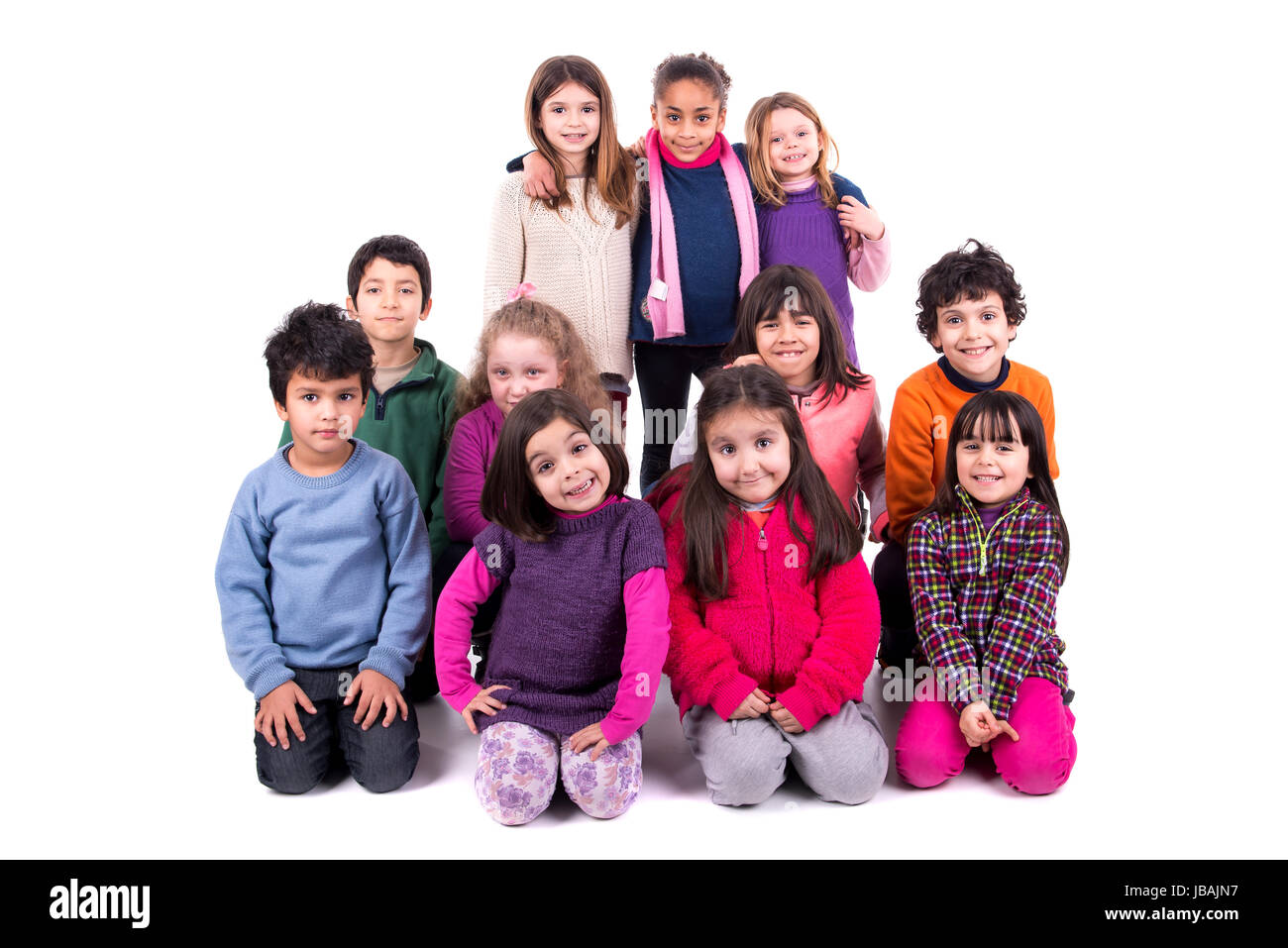 Group of children posing isolated in white Stock Photo - Alamy