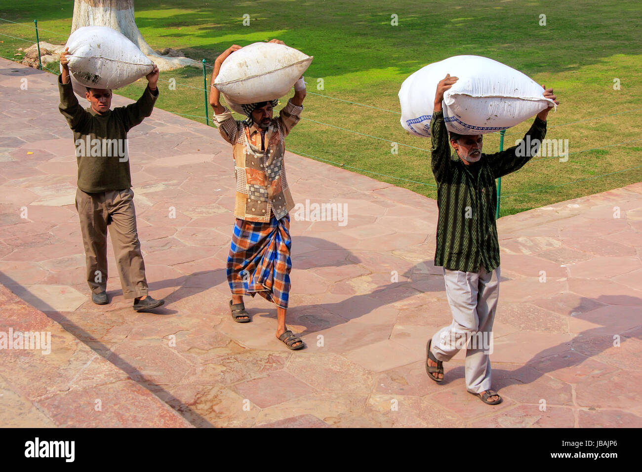 Man carrying sack on head hi-res stock photography and images - Alamy