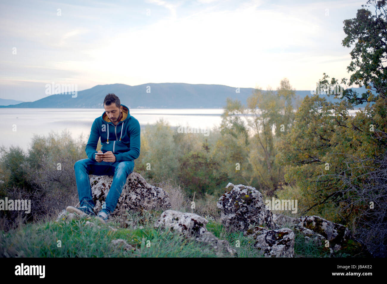 picture of a young handsome male model in nature Stock Photo - Alamy