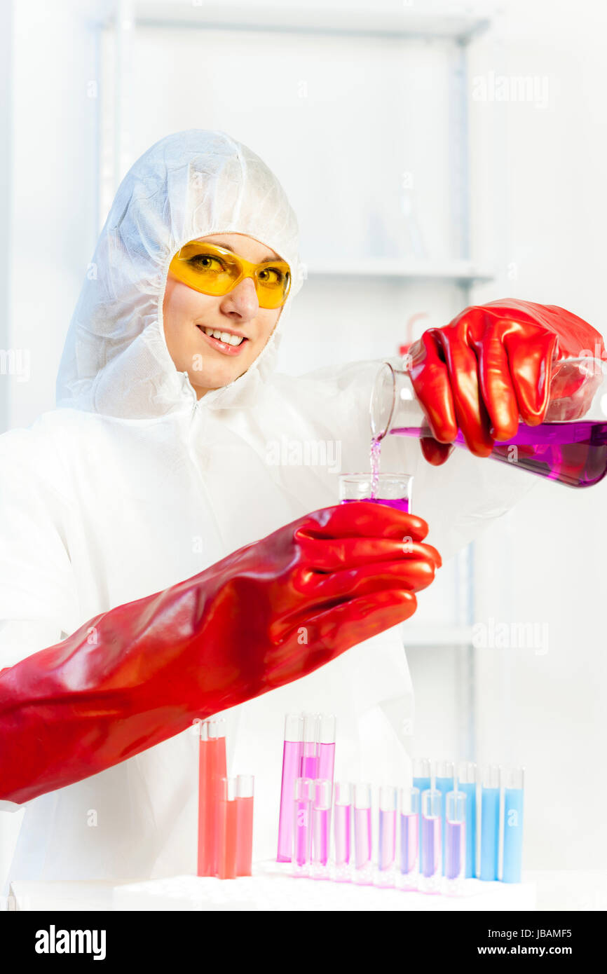 young woman wearing protective coat in laboratory Stock Photo - Alamy