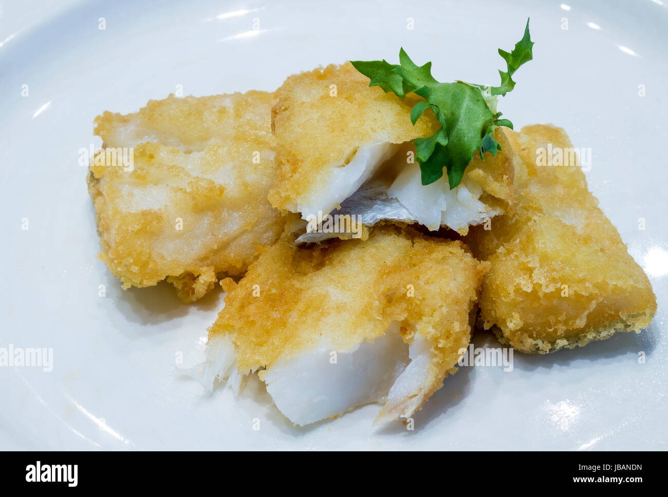 Fried fish fillet in white plate Stock Photo - Alamy