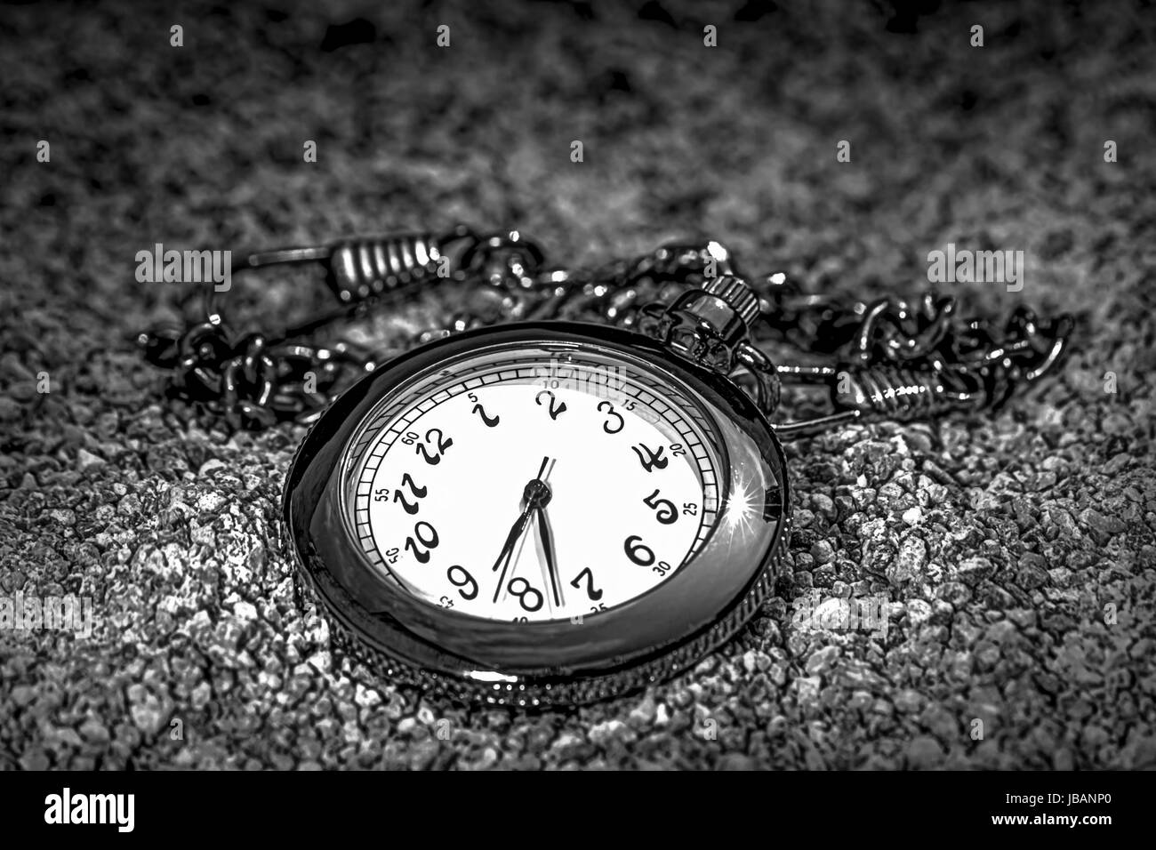 Chain Watch and sand in black and white Stock Photo - Alamy